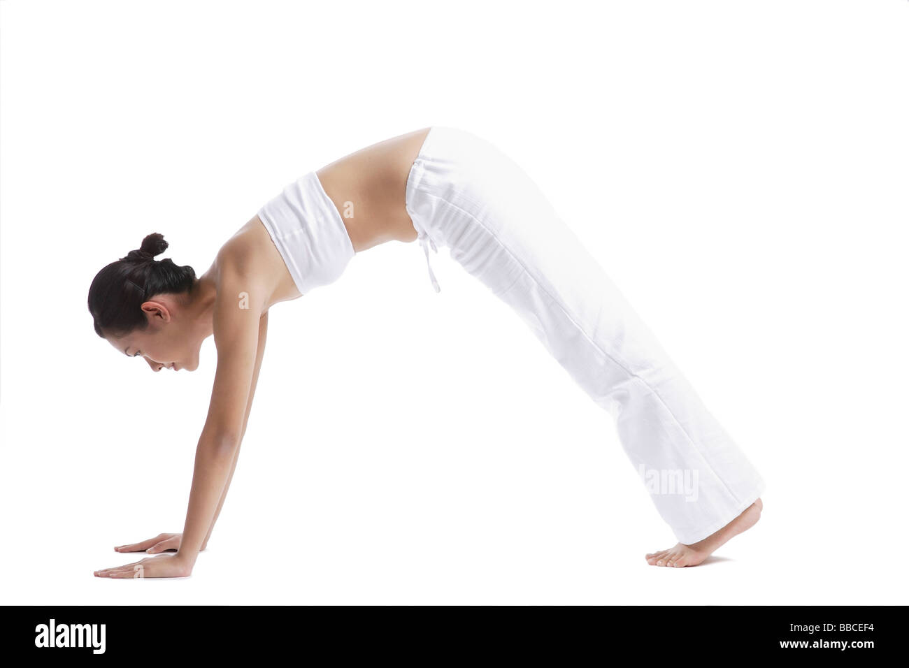 Young woman bending down Cut Out Stock Images & Pictures - Alamy