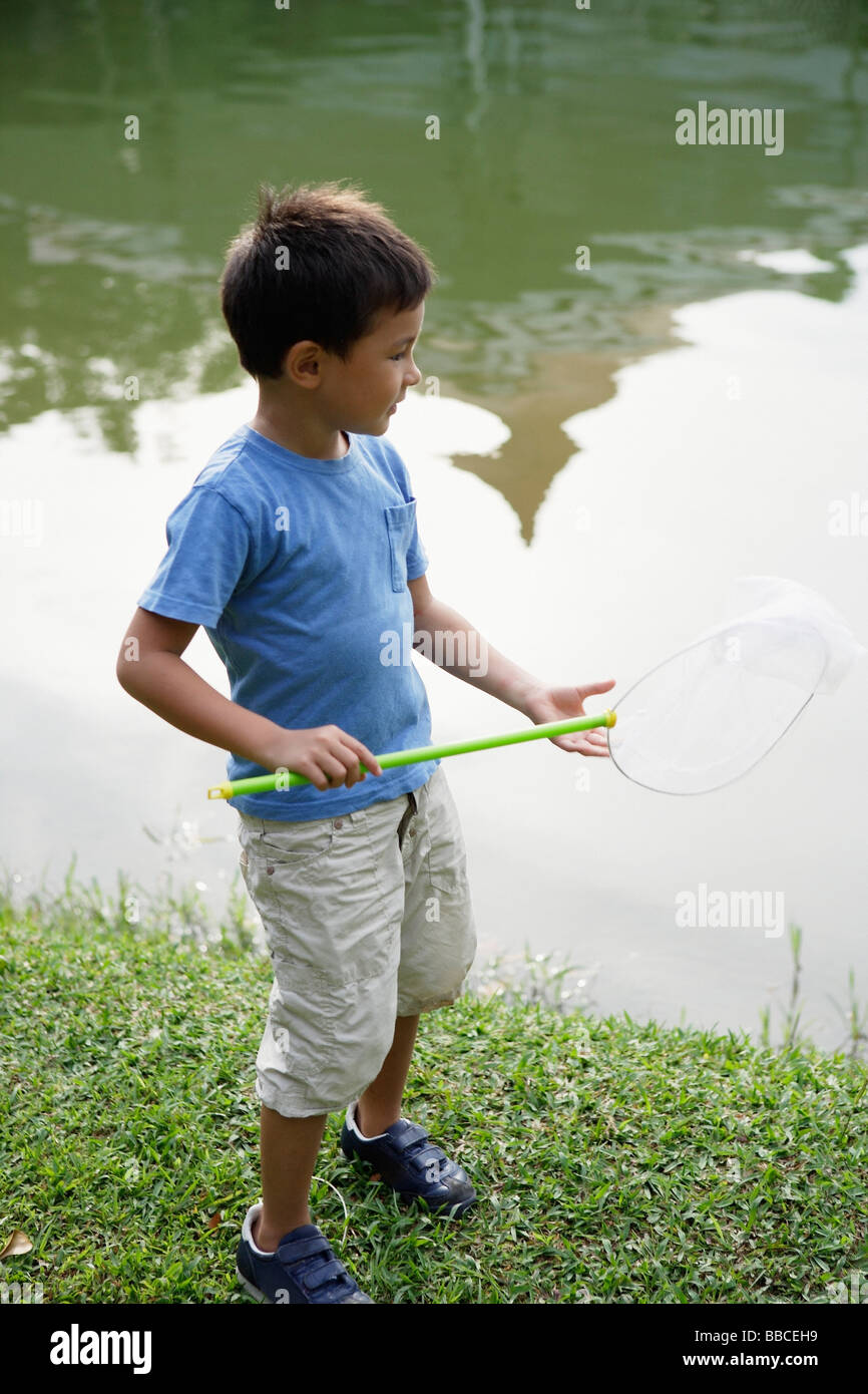 Boy with butterfly net Stock Photo - Alamy