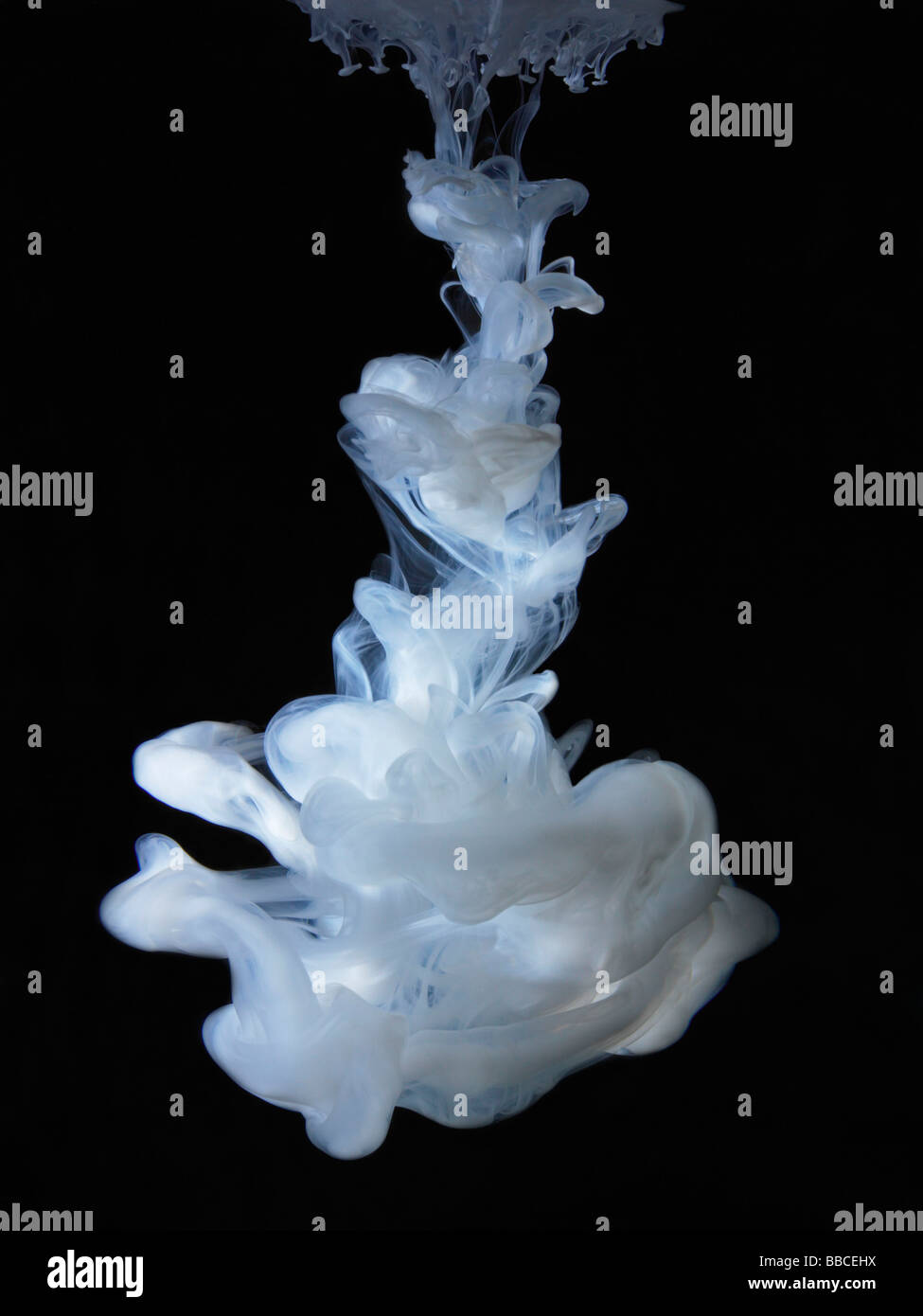 Milk in water Stock Photo - Alamy