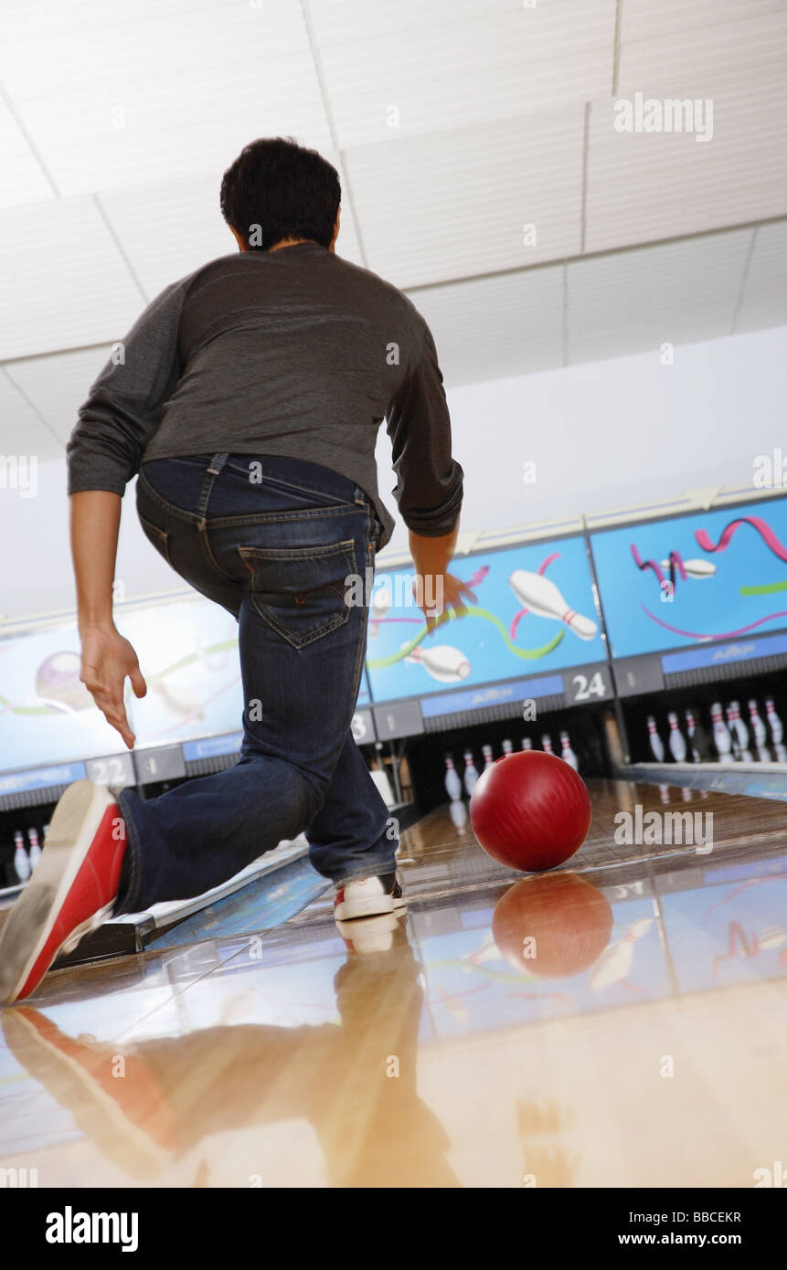 Man bowling in bowling alley Stock Photo - Alamy