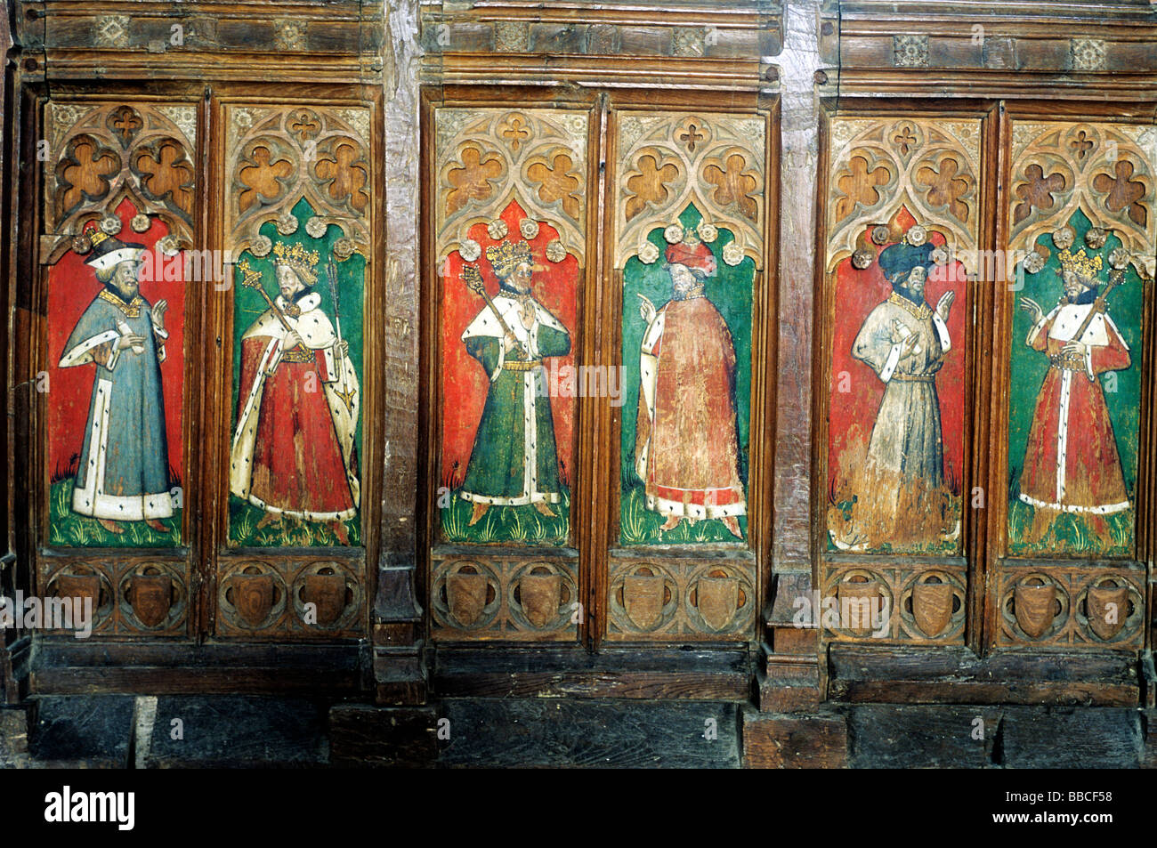 Medieval rood screen painted figures on dado Kersey Suffolk East Anglia ...