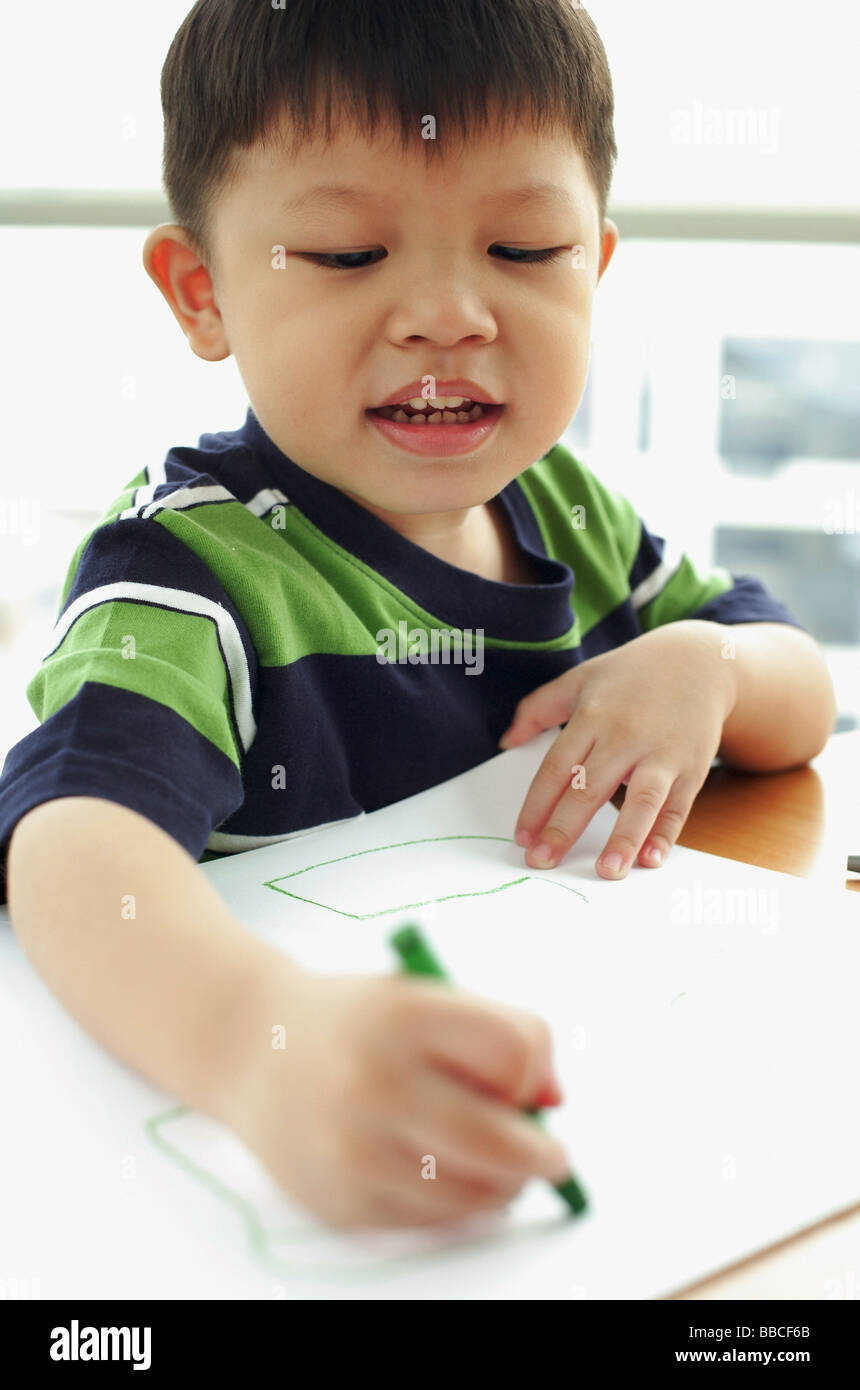 Young boy with crayon, drawing Stock Photo - Alamy
