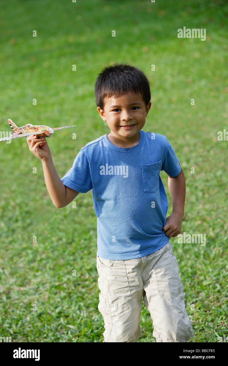 boy holding toy airplane Stock Photo - Alamy