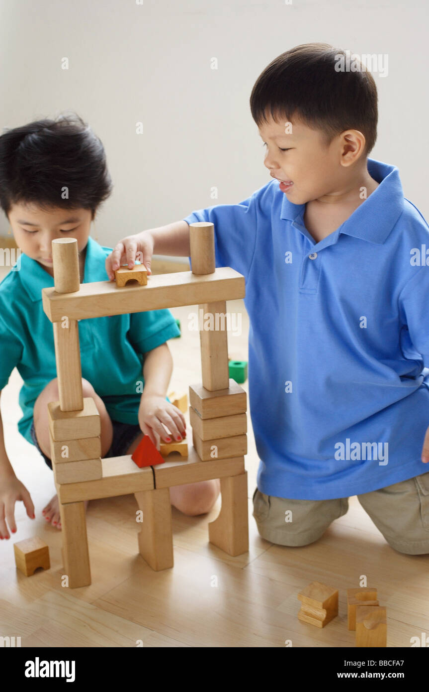 Children playing with building blocks Stock Photo - Alamy
