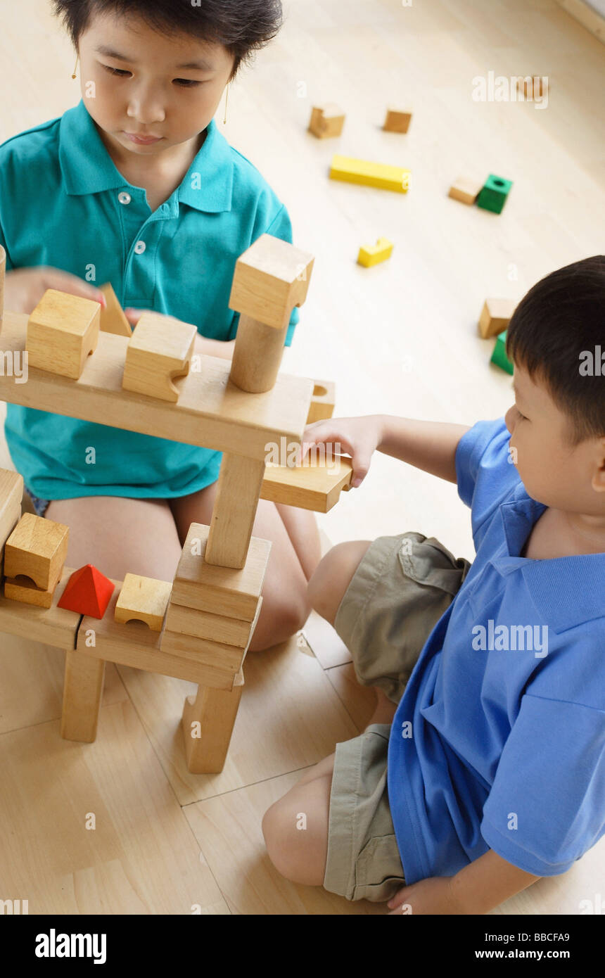 Children playing with building blocks hi-res stock photography and ...