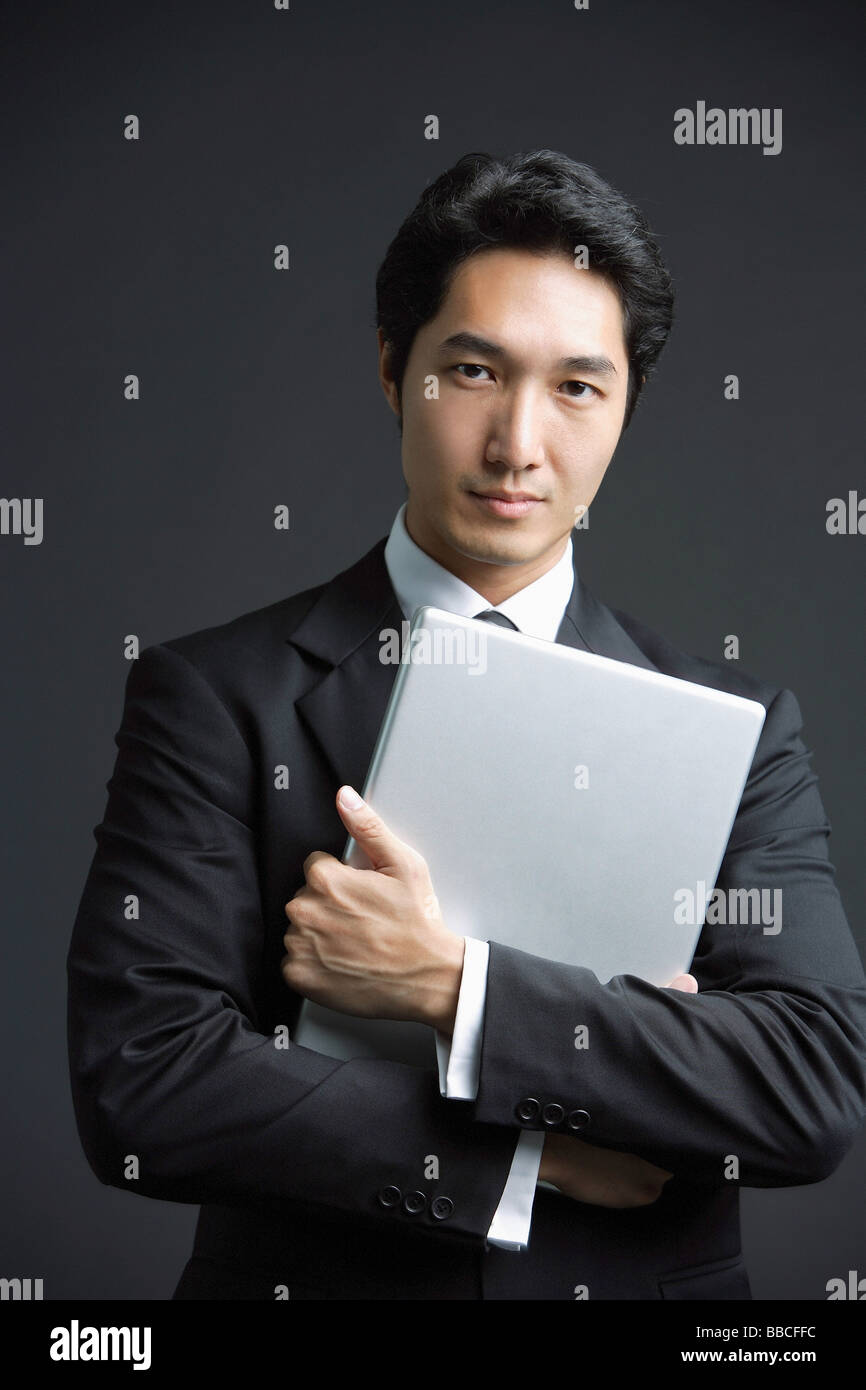 Businessman hugging laptop hi-res stock photography and images - Alamy