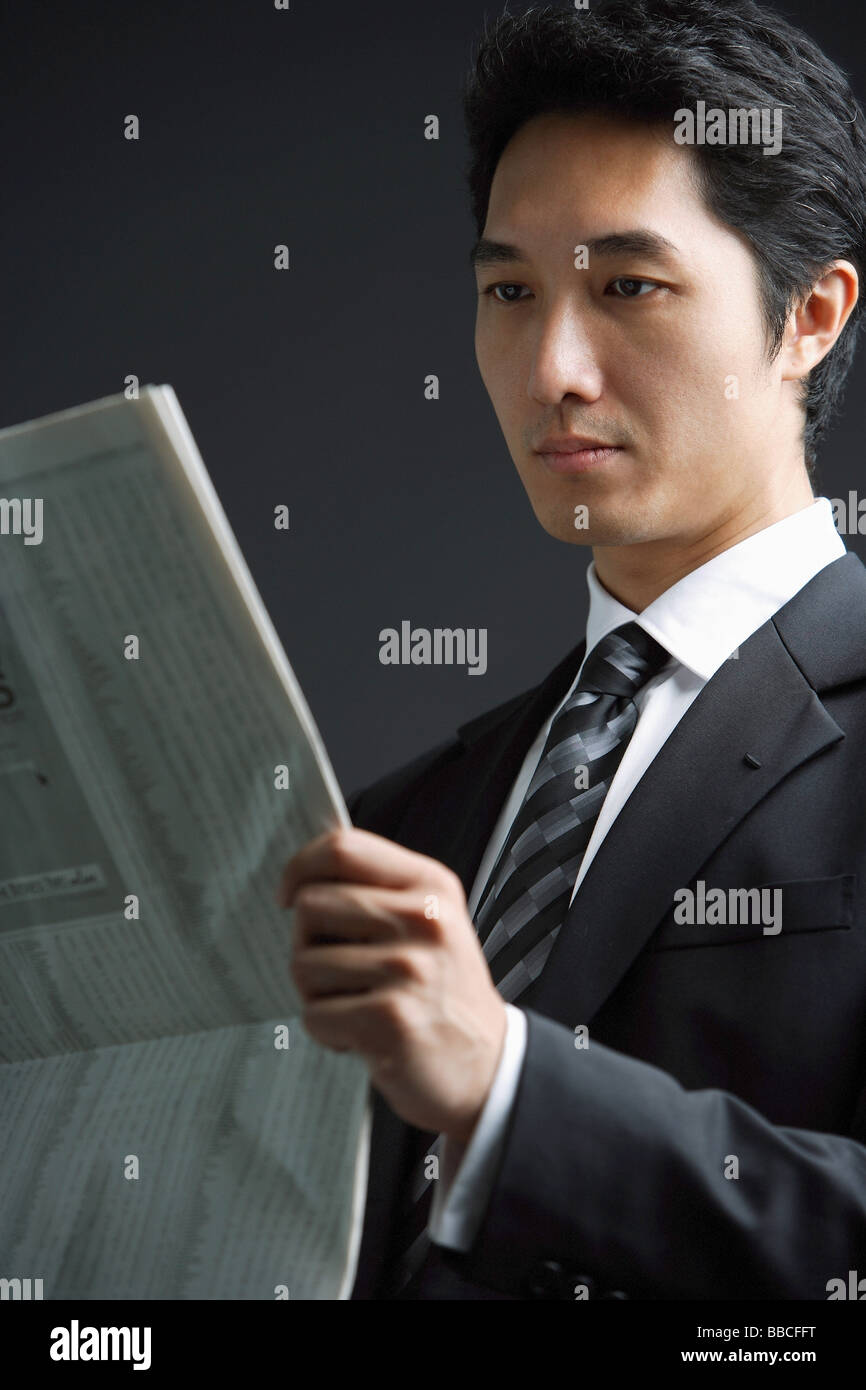 Businessman reading newspaper Stock Photo - Alamy Businessman reading newspaper Stock Photo - Alamy