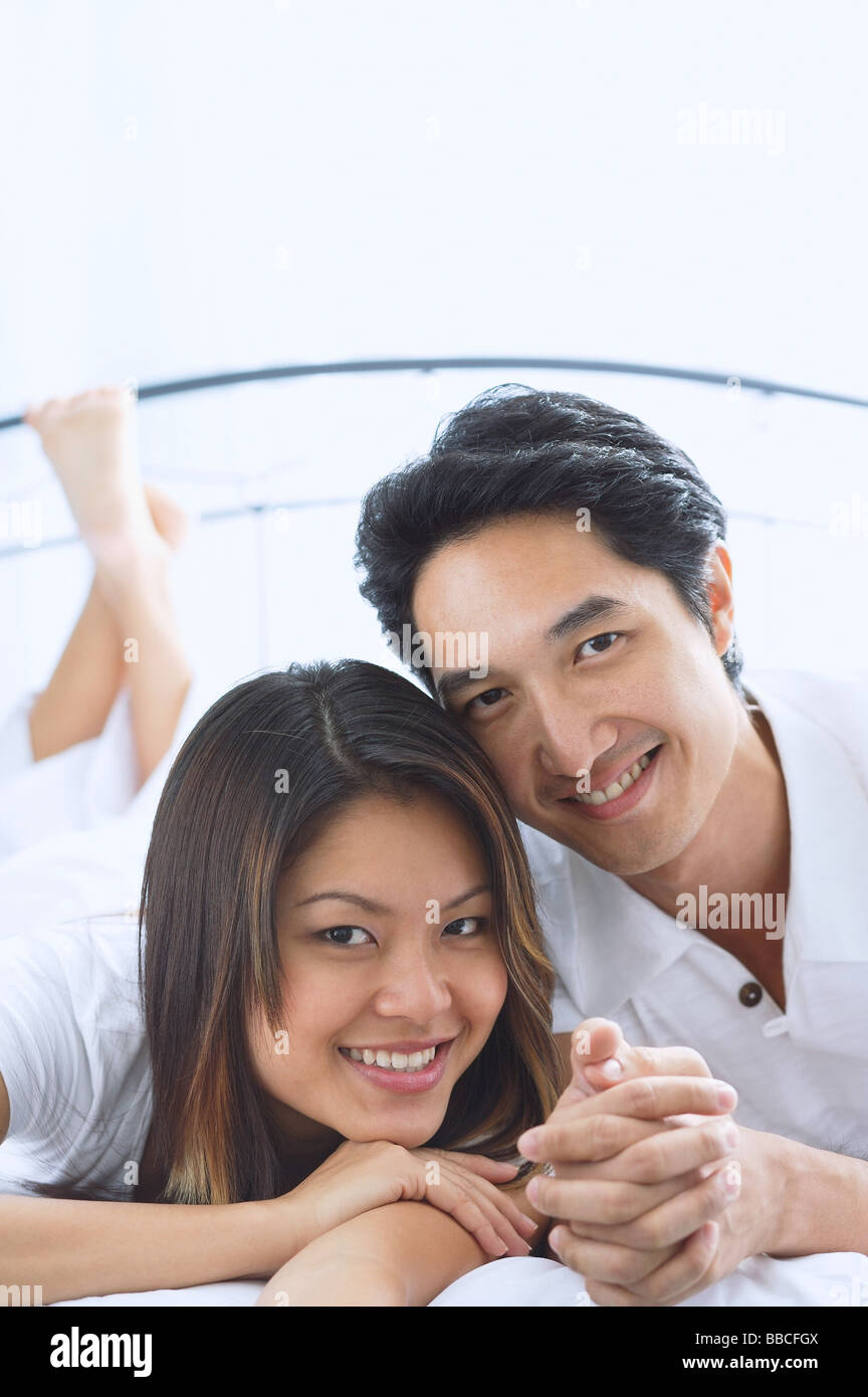 Couple side by side on bed hi-res stock photography and images - Alamy