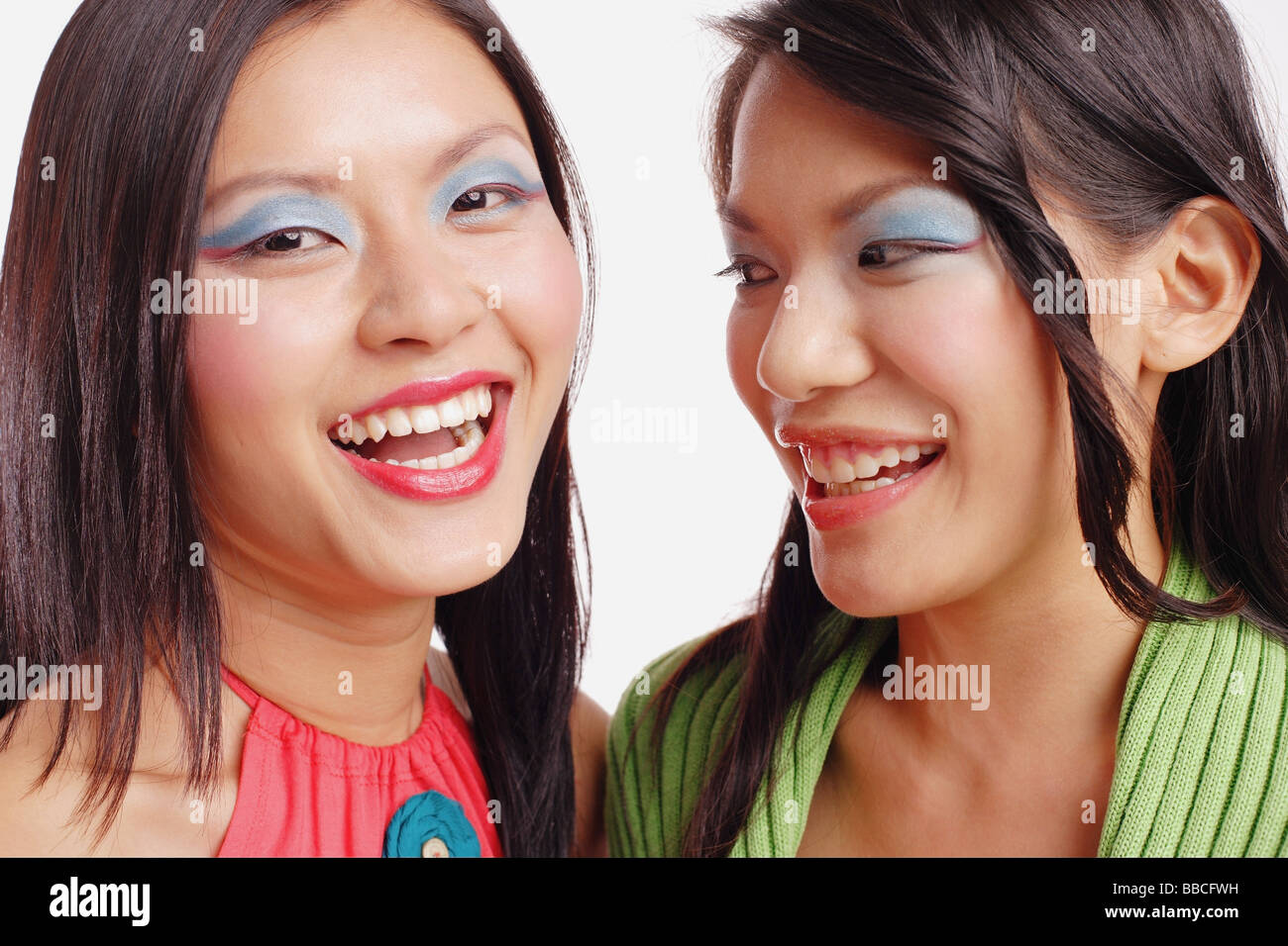 Two women with make up smiling Stock Photo - Alamy