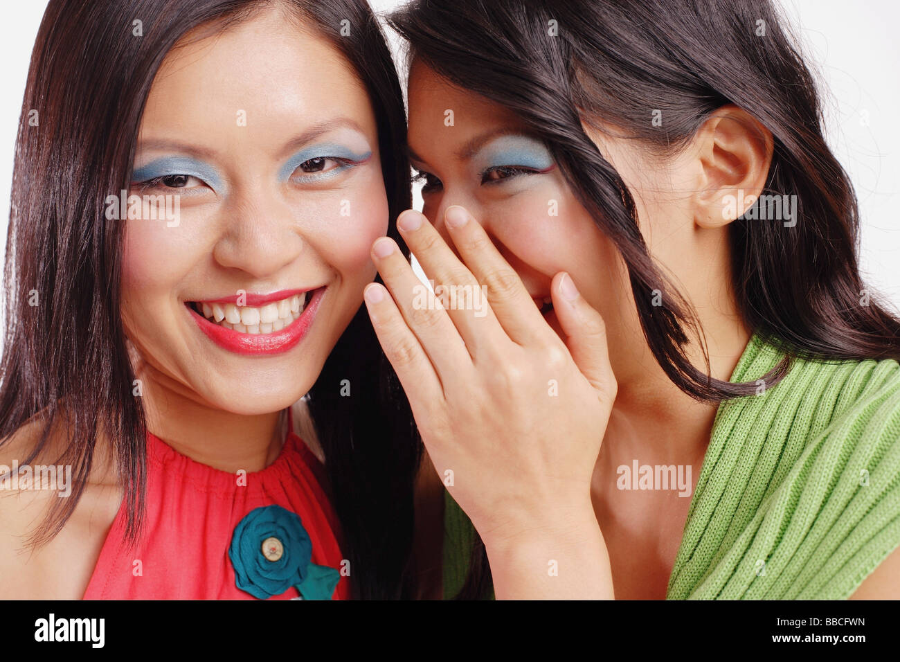 Whispering to each other hi-res stock photography and images - Alamy