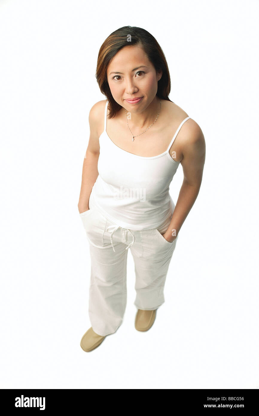 Woman looking up at camera, studio shot Stock Photo - Alamy