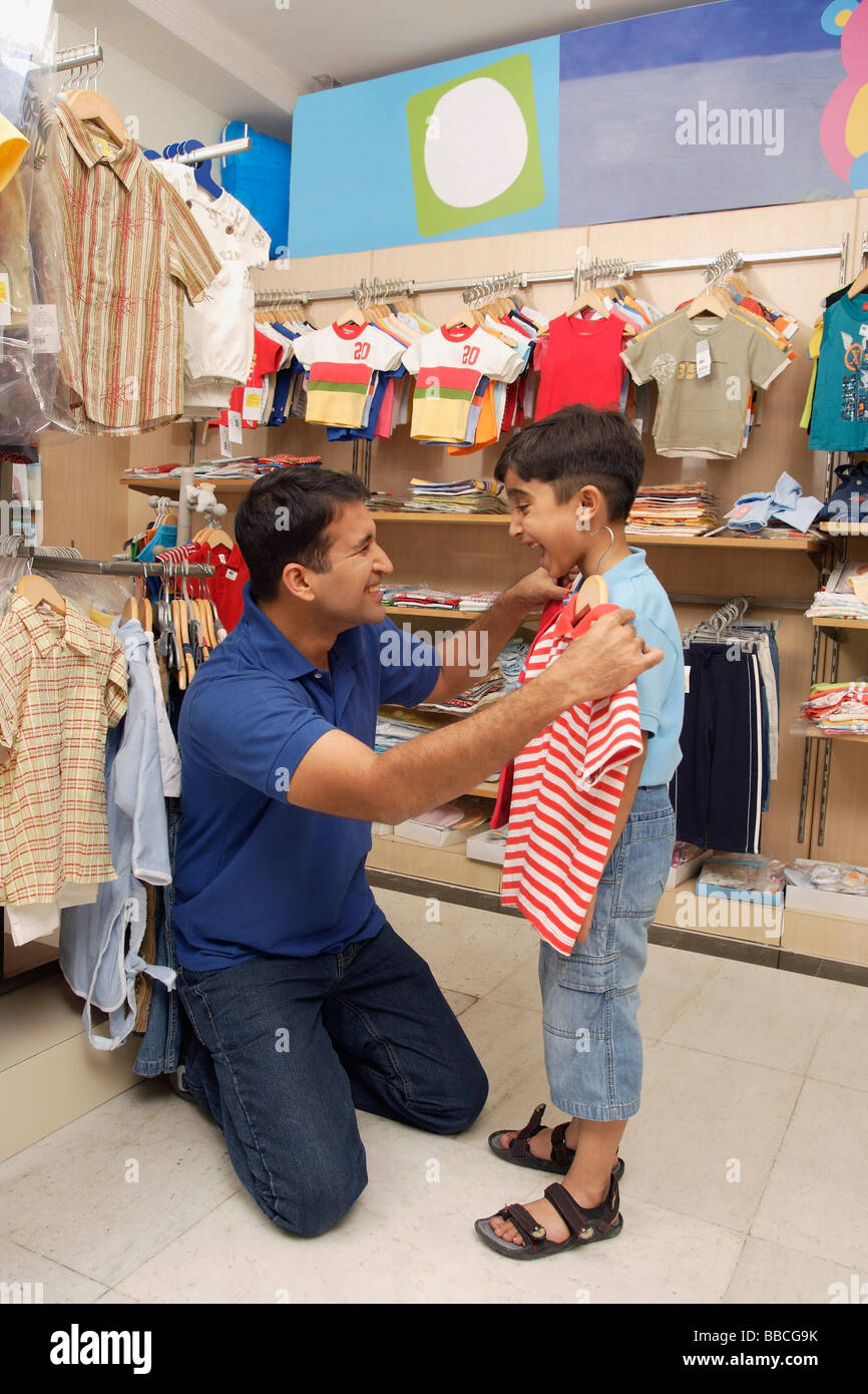 father and son shopping for clothes Stock Photo - Alamy