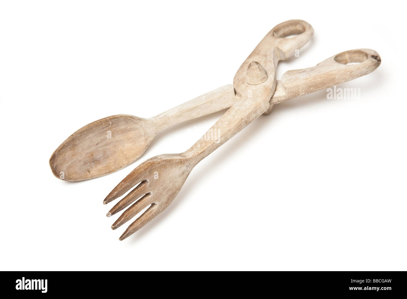 Wooden tongs isolated on a white studio background Stock Photo - Alamy