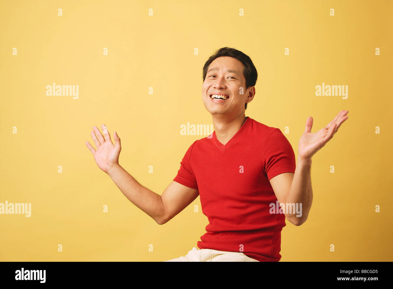 Man with arms outstretched, smiling Stock Photo - Alamy