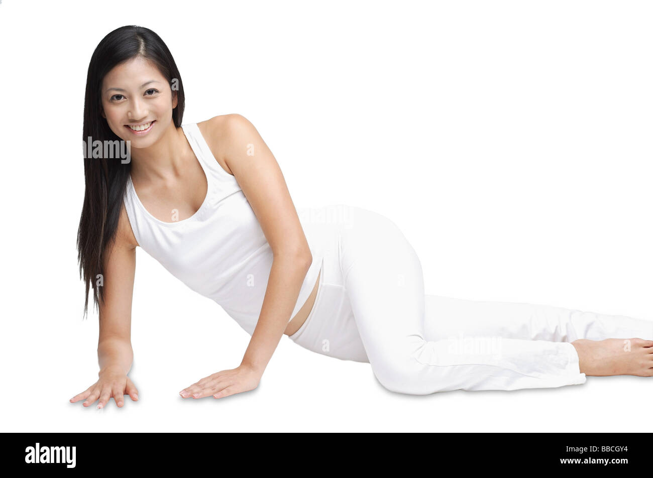 Woman lying on side, smiling at camera Stock Photo - Alamy