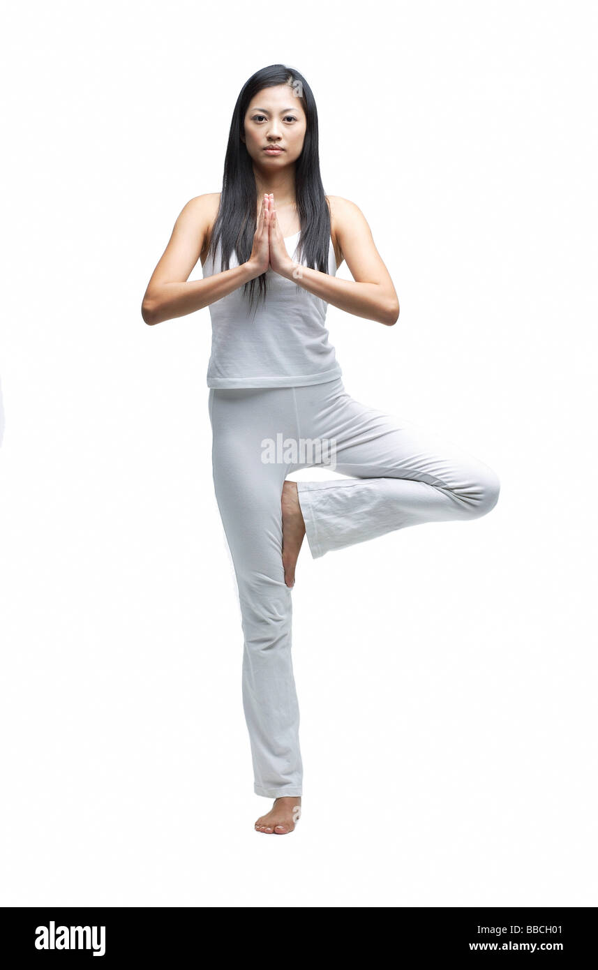 Woman standing in yoga position Stock Photo - Alamy
