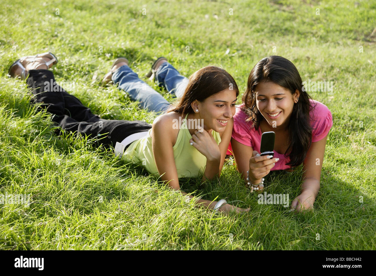 Teenage girl looking text messages hi-res stock photography and images ...