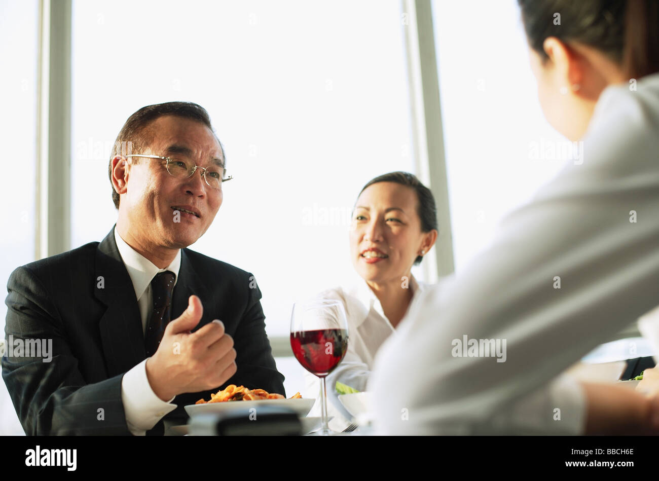 Asian business man talking over lunch hi-res stock photography and ...