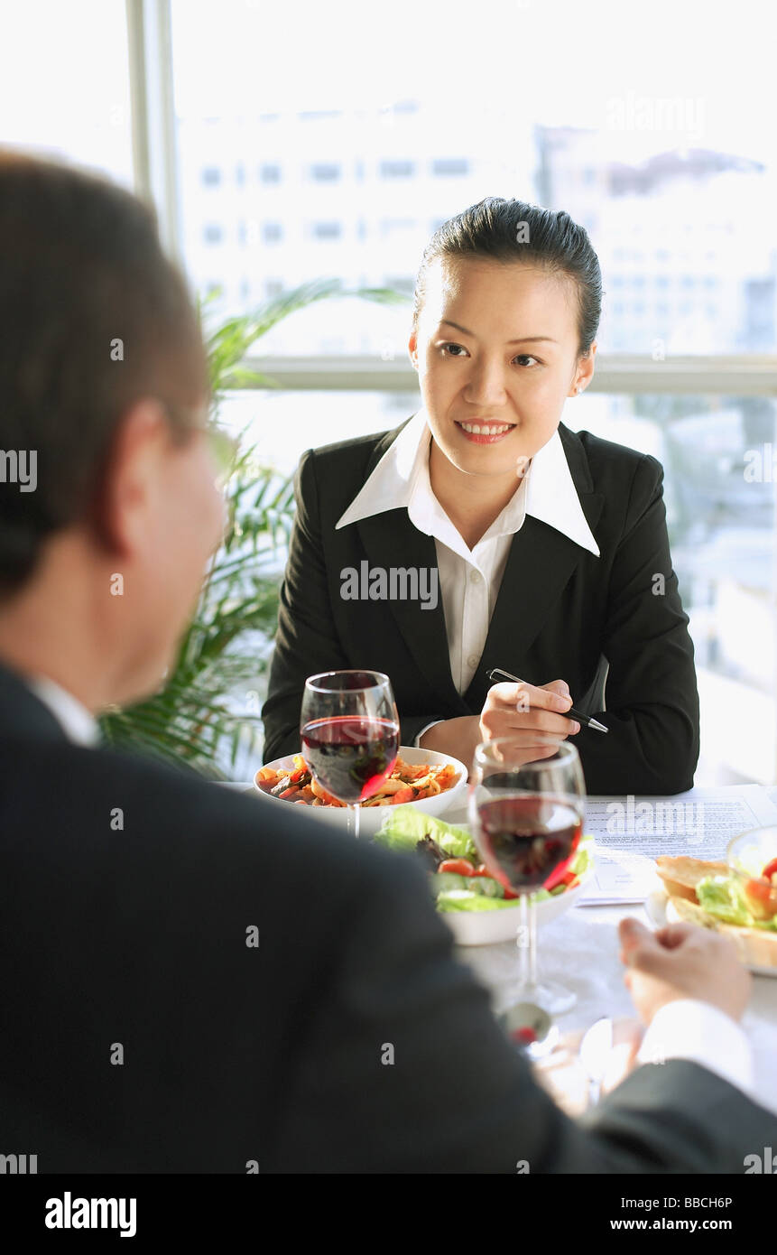 Executives discussing over lunch Stock Photo - Alamy