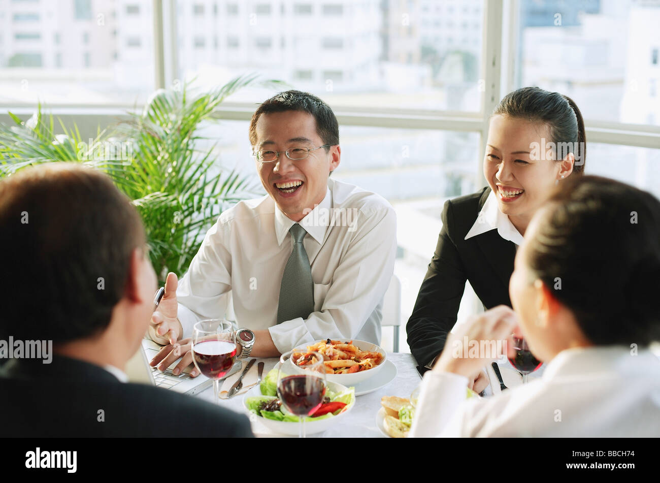 Asian business man talking over lunch hi-res stock photography and ...