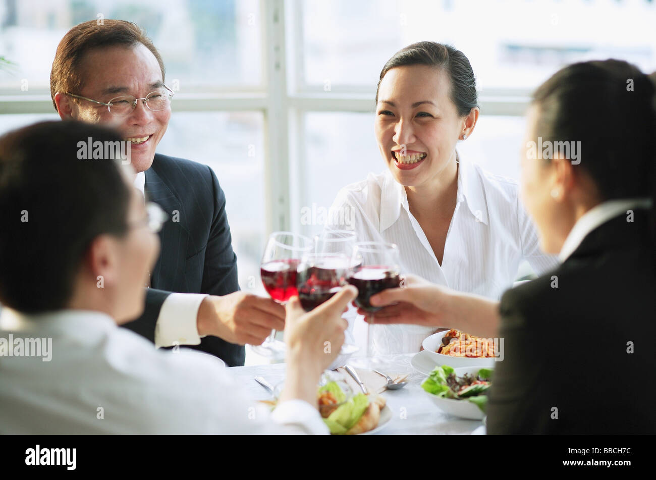 Toasting business lunch smiling hi-res stock photography and images - Alamy