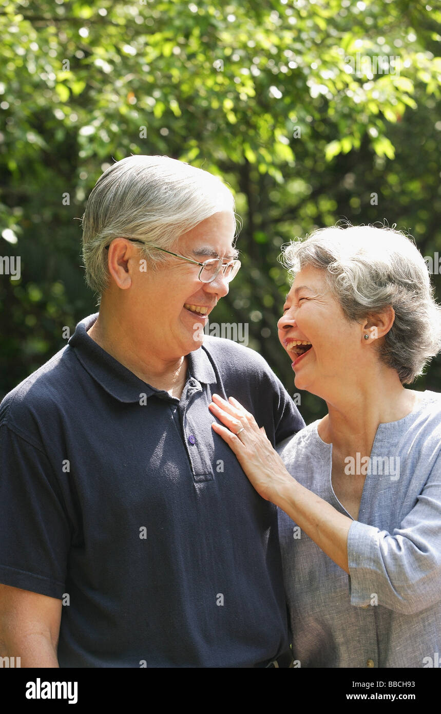 Senior couple facing each other, smiling Stock Photo - Alamy