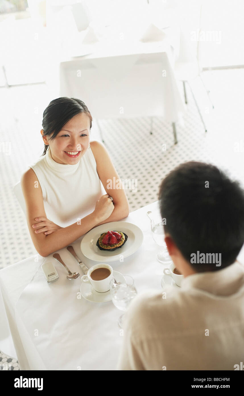 Two women sitting opposite each other hi-res stock photography and ...