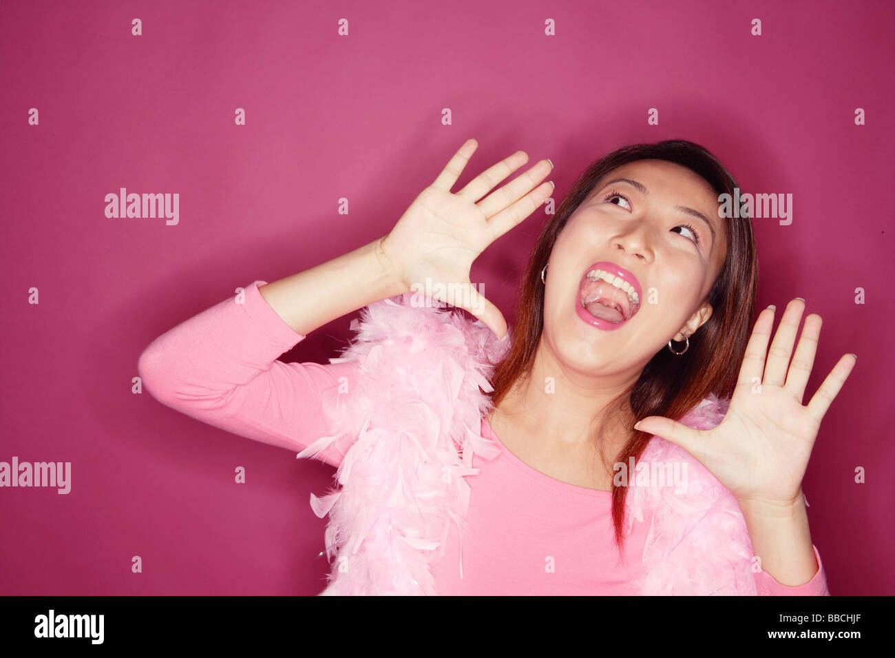 Woman wearing feather boa hi-res stock photography and images - Alamy