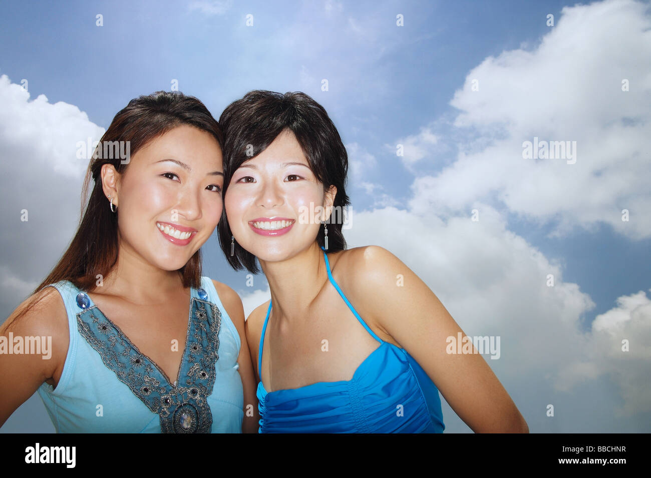 Two women smiling at camera Stock Photo - Alamy