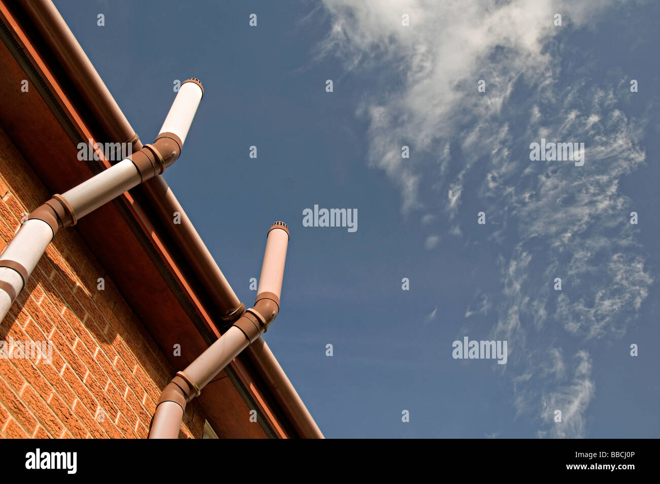 a ventilation pipe on a modern house that lets gases from the sewer ...