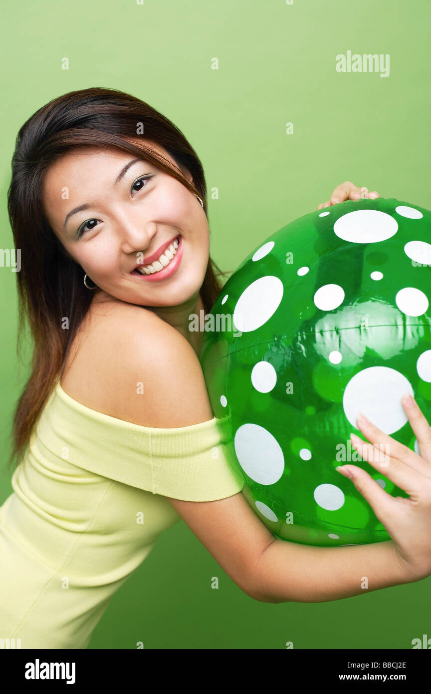 Woman hugging inflatable ball hi-res stock photography and images - Alamy