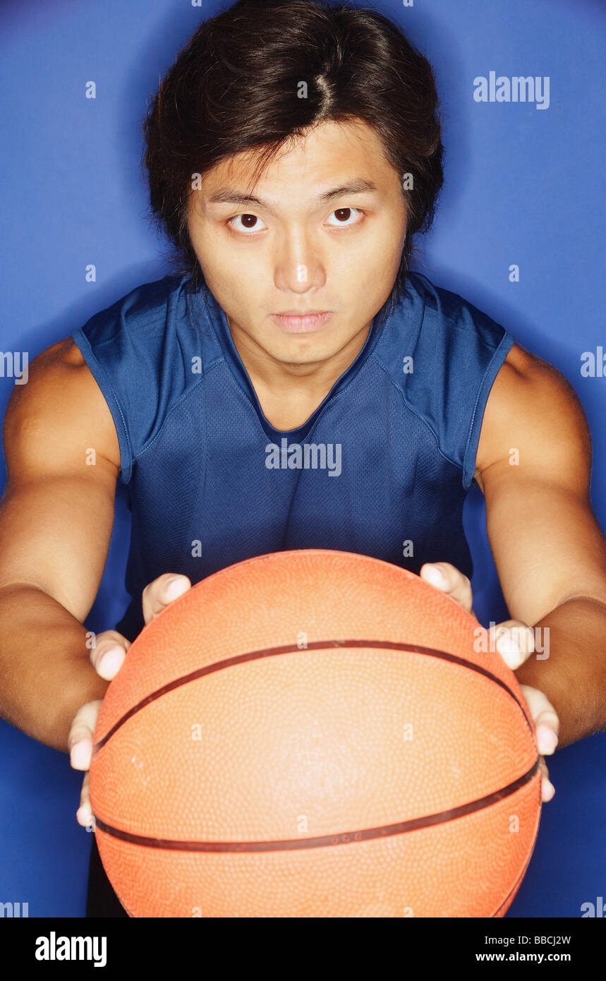 Man holding basketball towards camera hi-res stock photography and ...