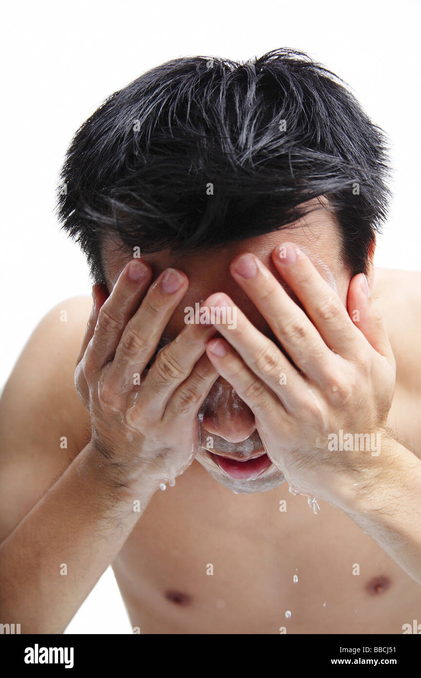 Man washing face Stock Photo - Alamy
