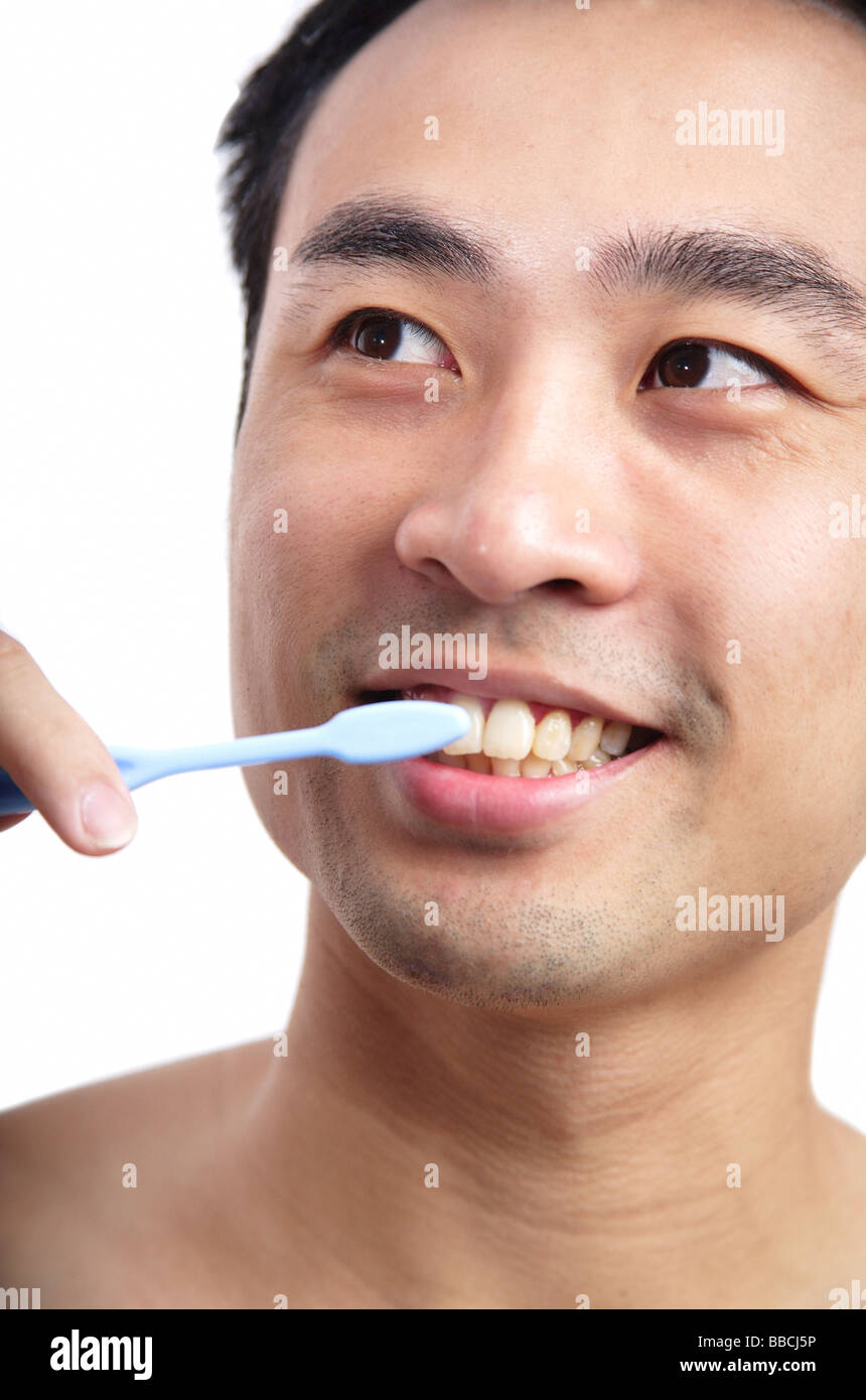 Man brushing teeth Stock Photo - Alamy