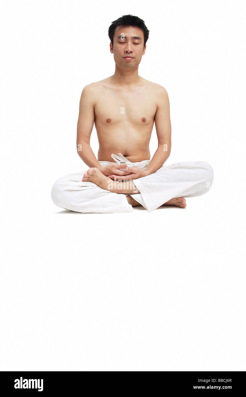 Man sitting in lotus position Stock Photo - Alamy