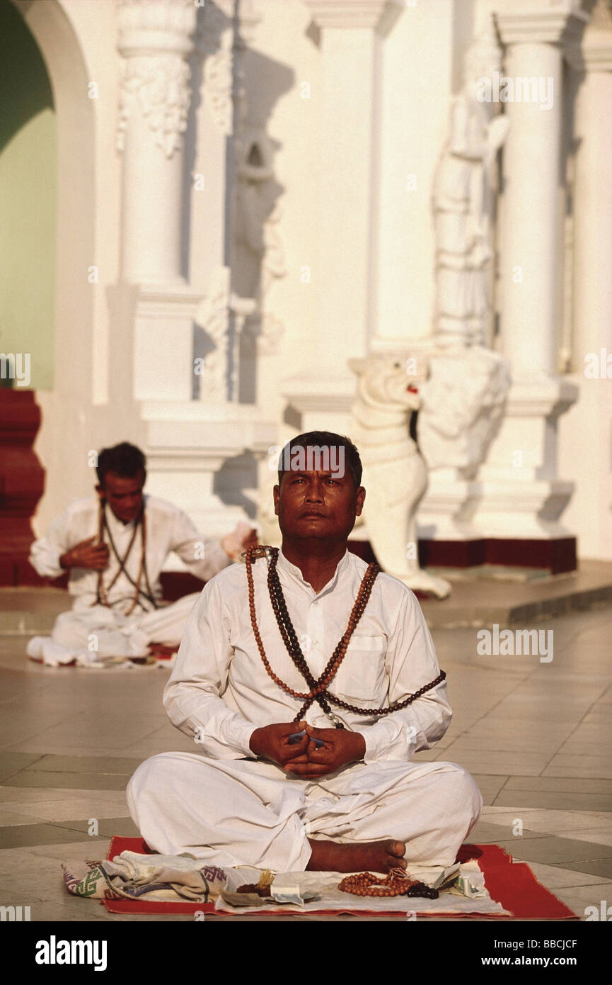 Myanmar (Burma), Yangon, Ascetic man stares into sun whilst meditating ...