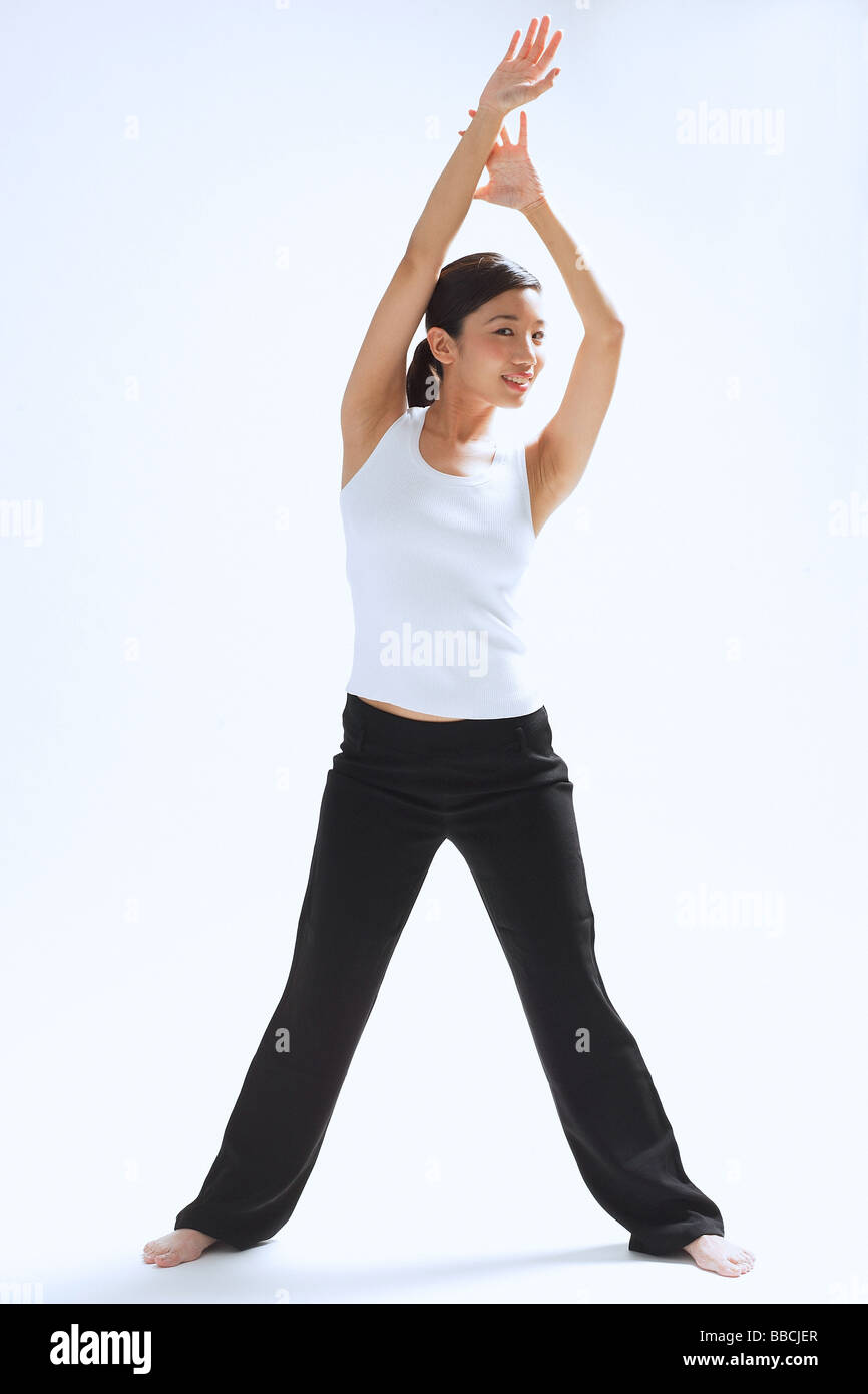 Hands raised over her head hi-res stock photography and images - Alamy