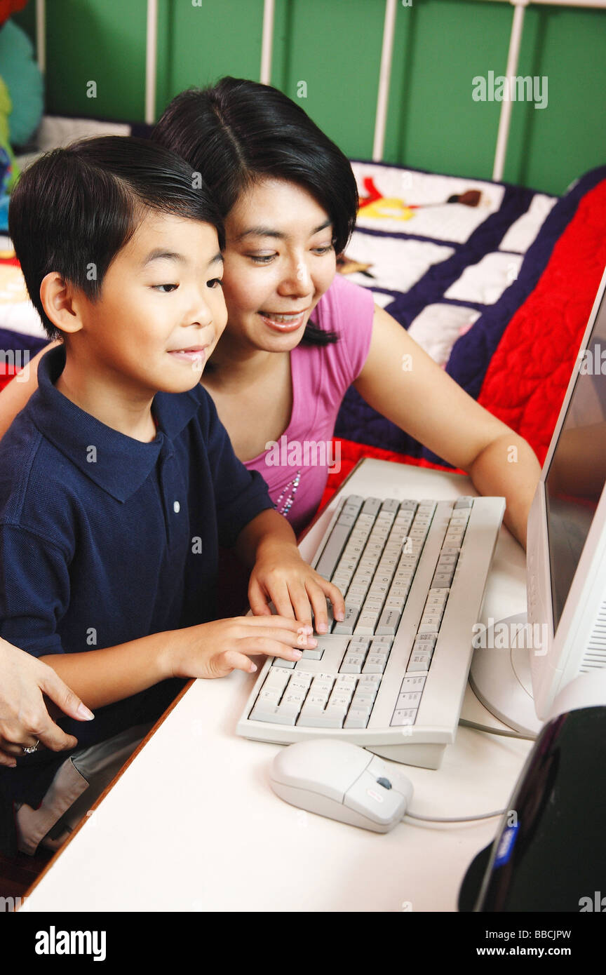 Mother and son using computer Stock Photo - Alamy Mother and son using computer Stock Photo - Alamy