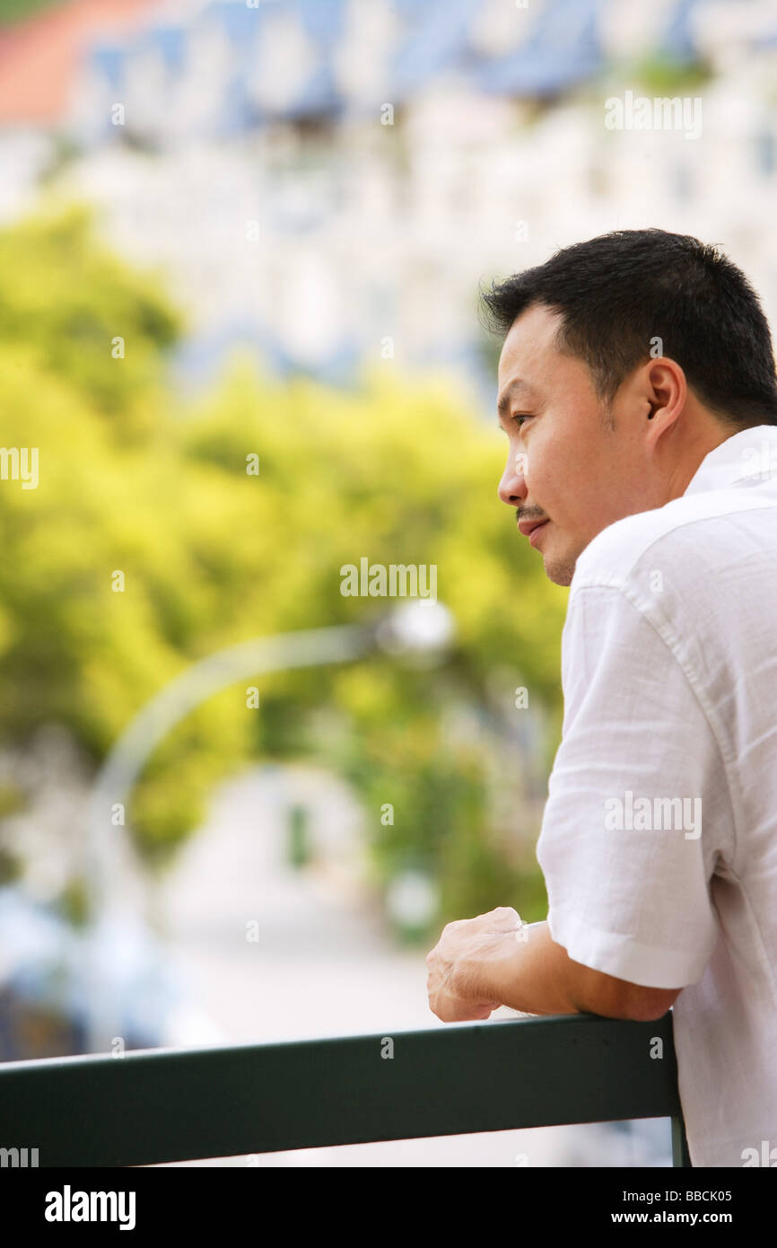 Man leaning over railing hi-res stock photography and images - Alamy