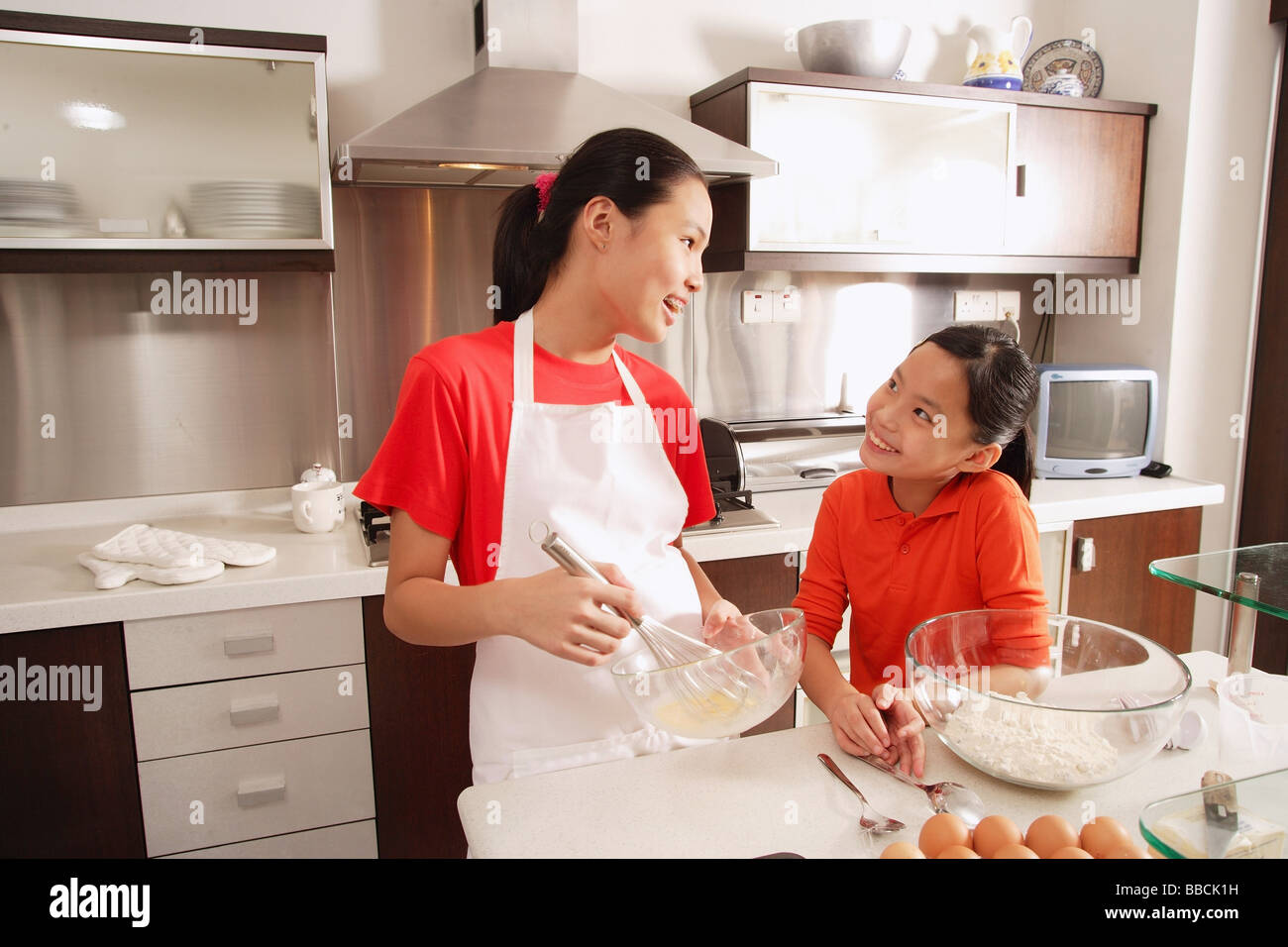 Two sisters standing back back hi-res stock photography and images - Alamy