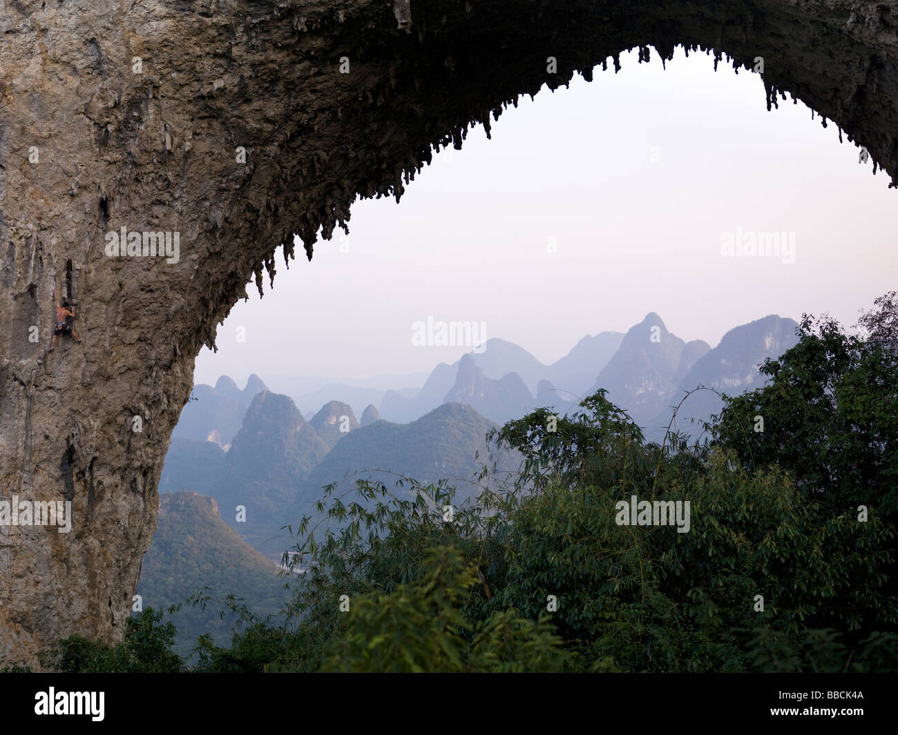 Natural arch in mountains Stock Photo - Alamy