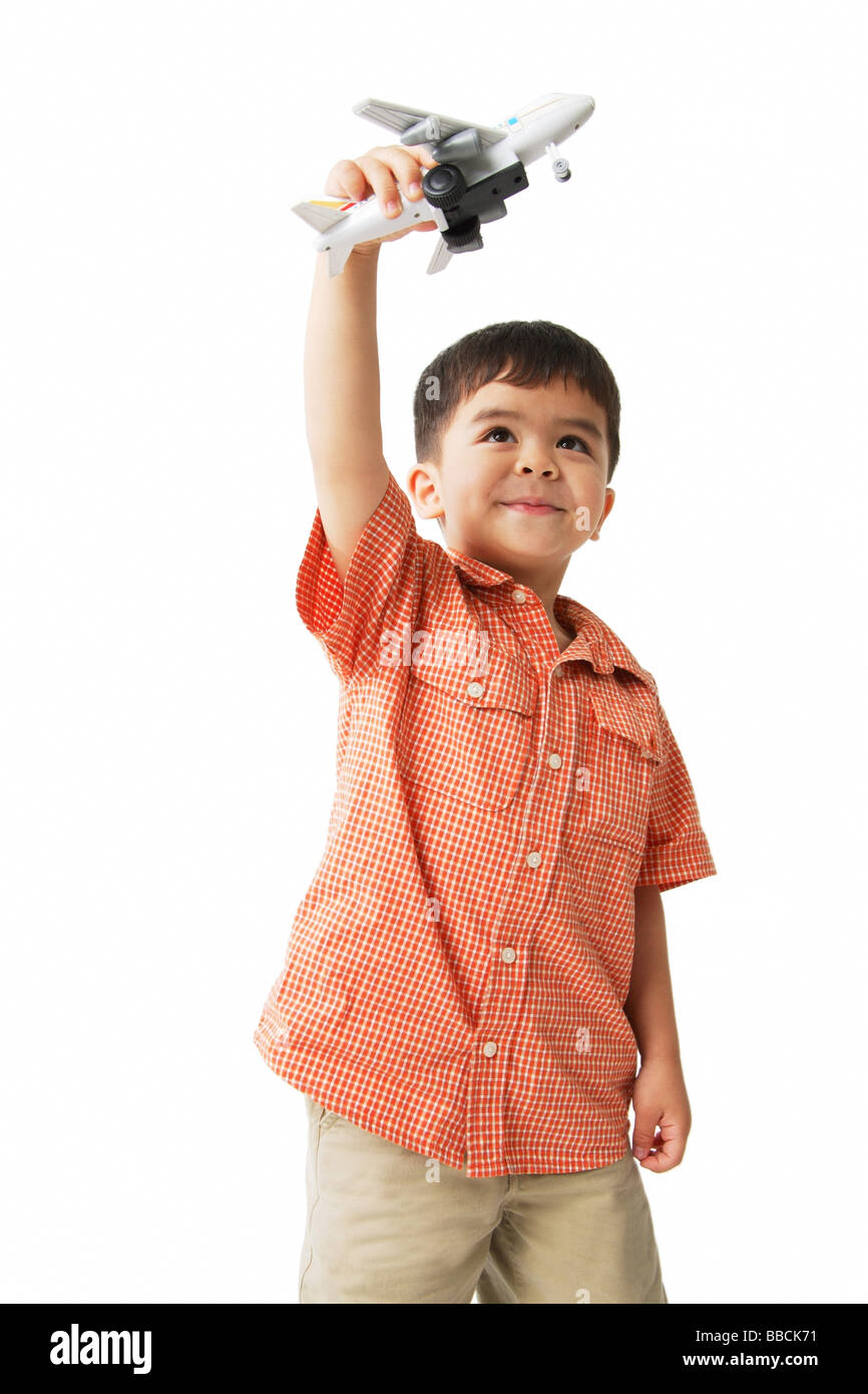 Boy holding toy airplane, playing Stock Photo - Alamy