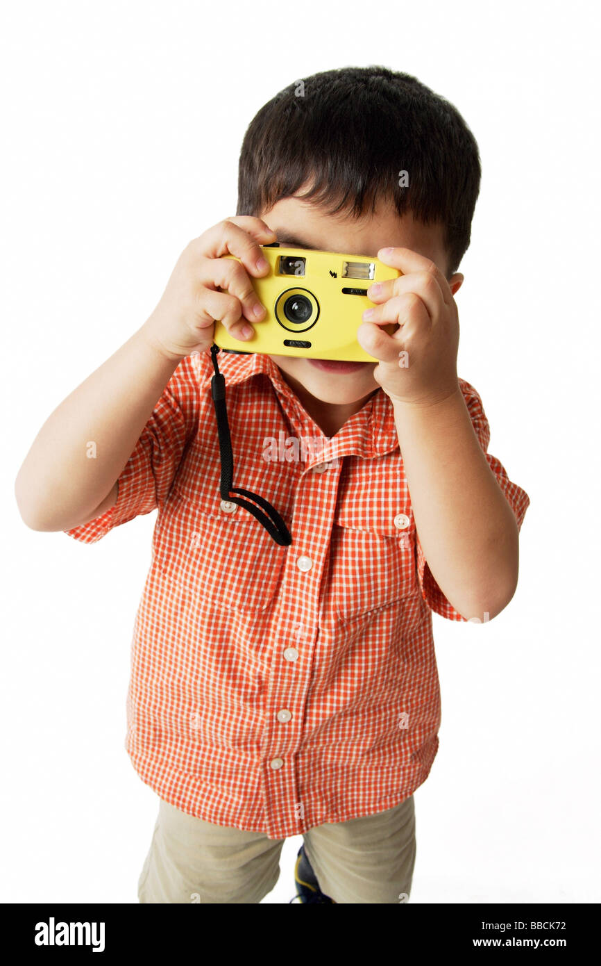 Boy looking through camera Stock Photo - Alamy