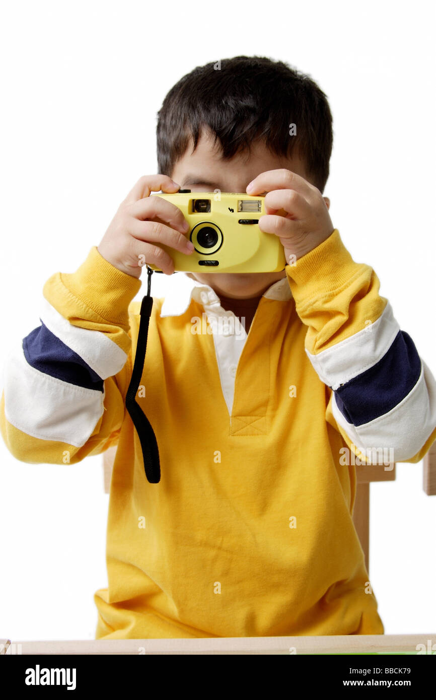 Boy looking through camera Stock Photo - Alamy