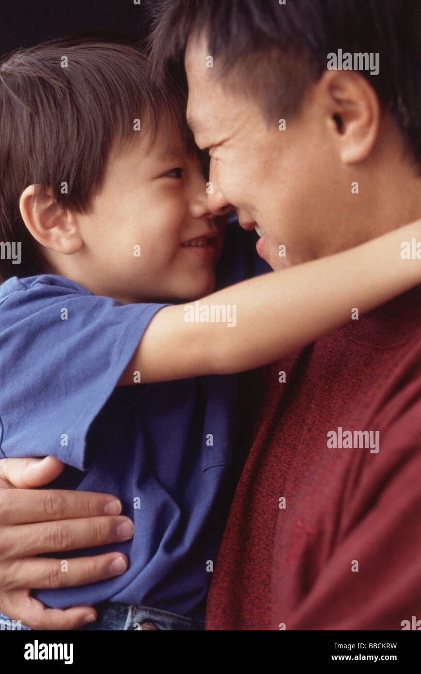 Father and son hugging each other Stock Photo - Alamy