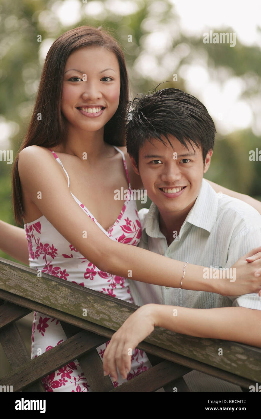 Couple smiling, looking at camera Stock Photo - Alamy