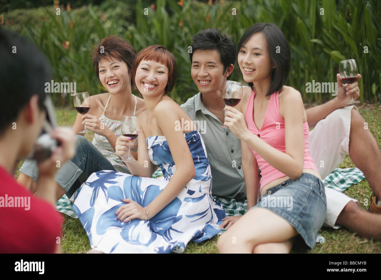 Friends posing for pictures Stock Photo - Alamy