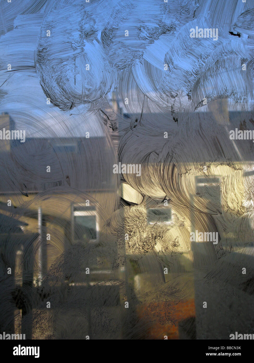 property window with white wash pattern and houses Stock Photo - Alamy