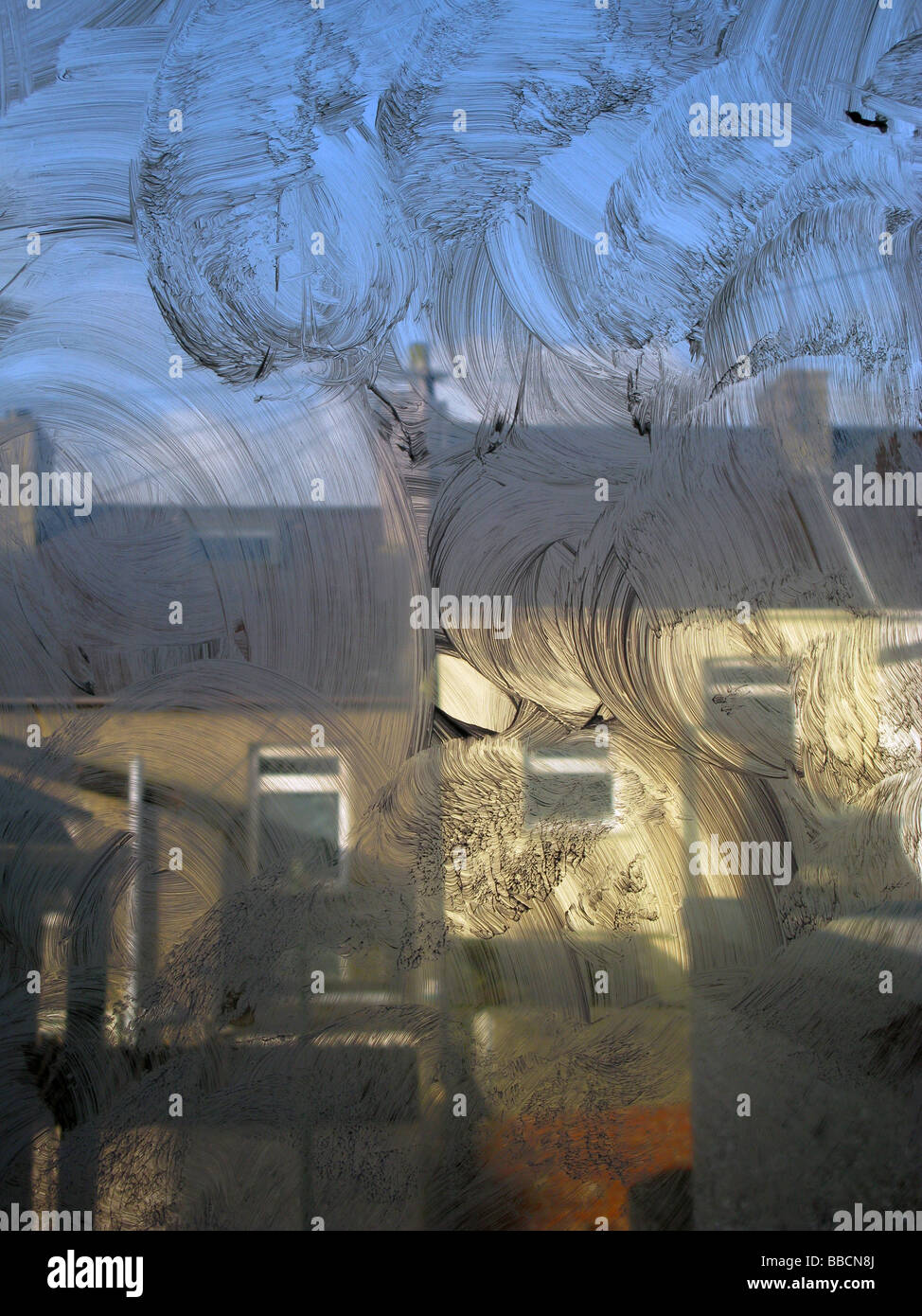 property window with white wash pattern and houses Stock Photo - Alamy