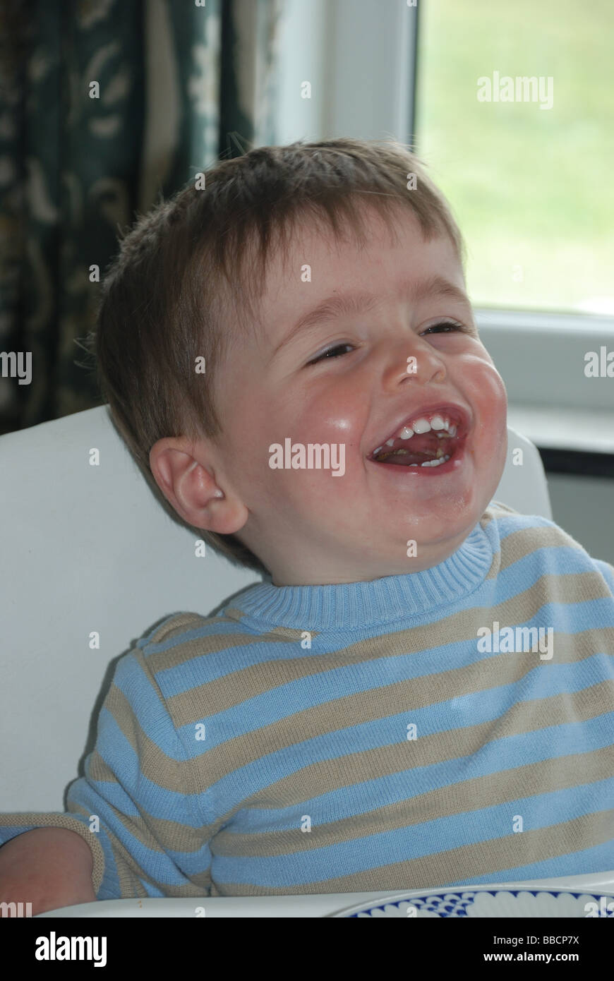 Baby boy laughing Stock Photo - Alamy